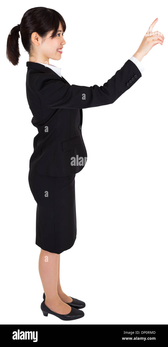 Smiling businesswoman pointing Stock Photo - Alamy