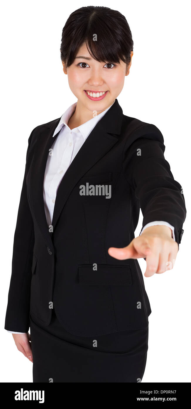 Smiling businesswoman pointing Stock Photo - Alamy