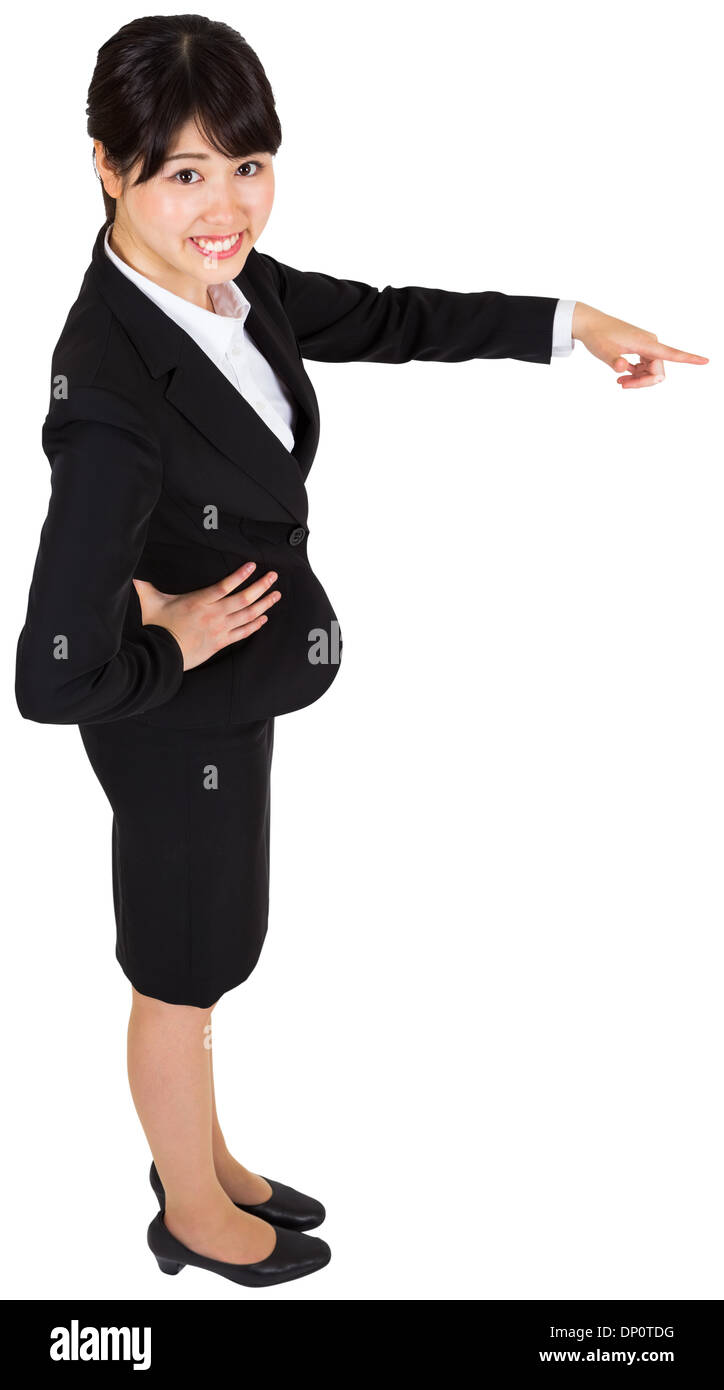 Smiling businesswoman pointing Stock Photo - Alamy