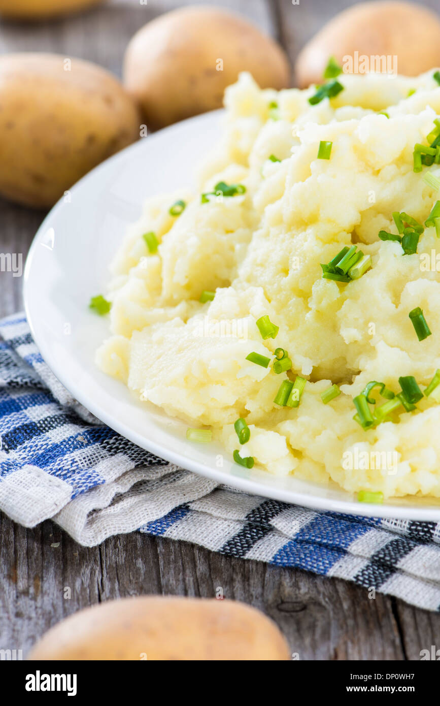 Portion of Mashed Potato on vintage background Stock Photo - Alamy