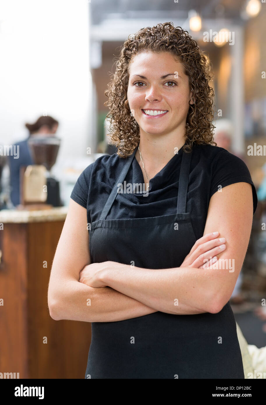 Confident Waitress In Cafeteria Stock Photo - Alamy