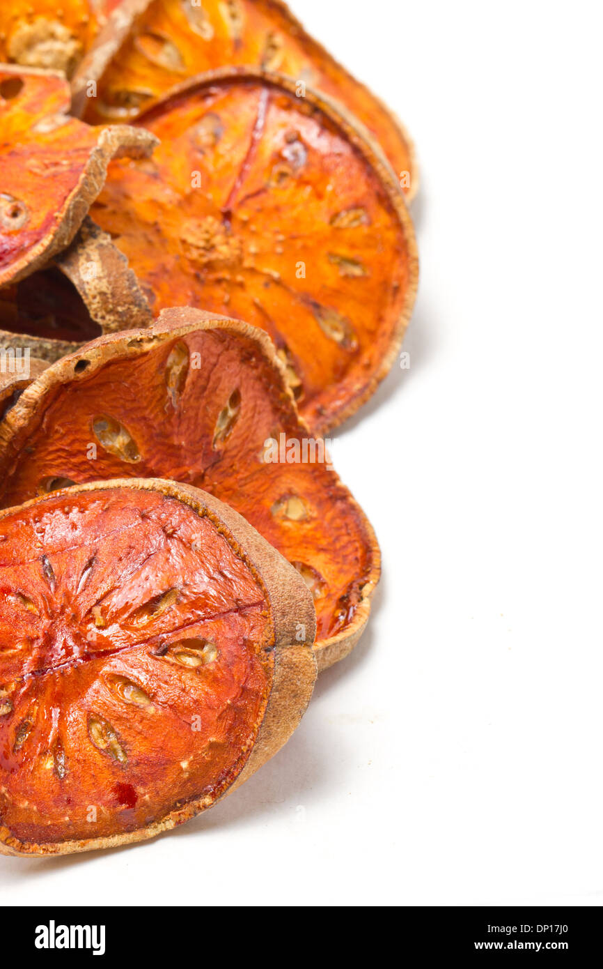 Slices of dried bael fruit Stock Photo - Alamy