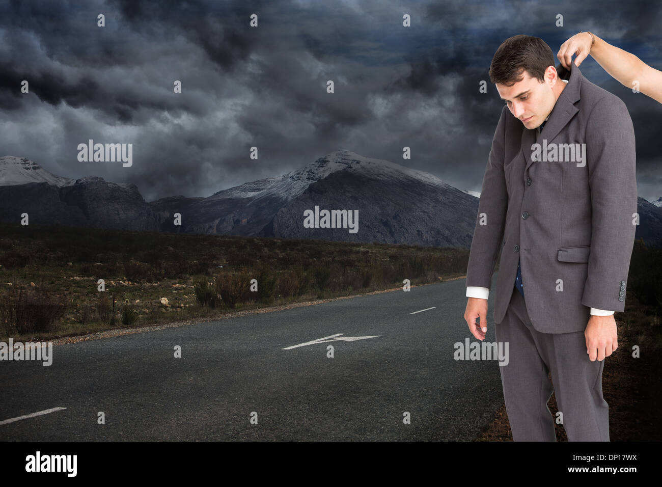 Composite image of businessman hanging Stock Photo - Alamy