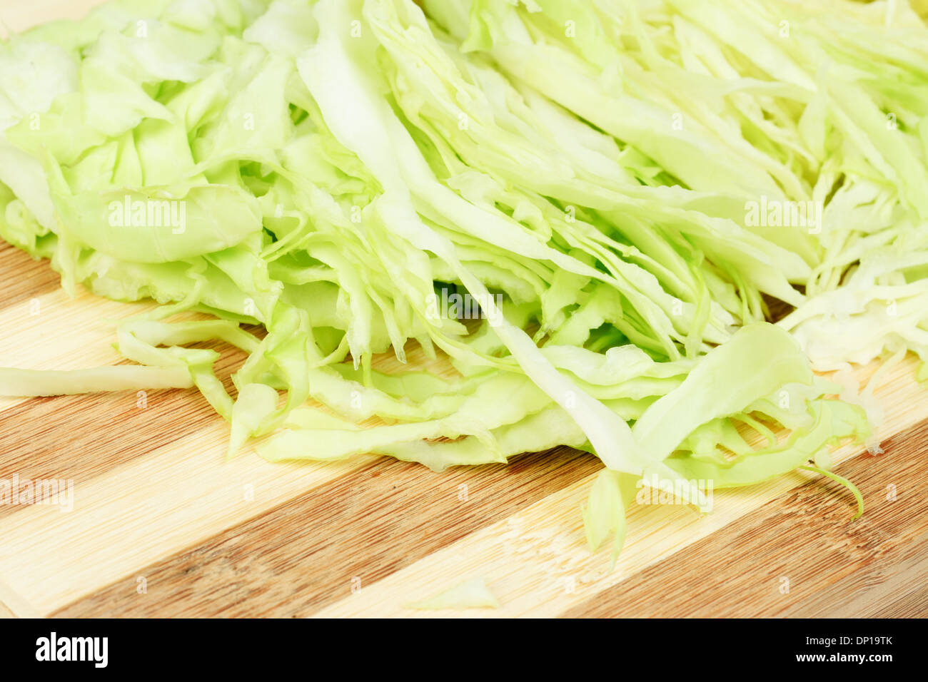 Green cabbage sliced on cutting board Stock Photo - Alamy