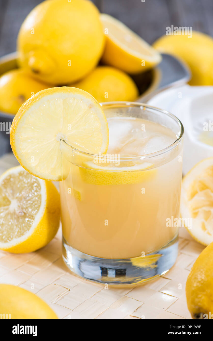 Fresh Lemon Juice in a glass with some fruits Stock Photo - Alamy