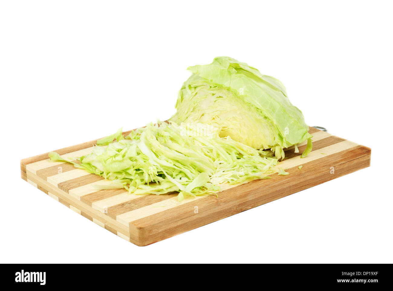Green cabbage sliced on cutting board isolated on white Stock Photo - Alamy
