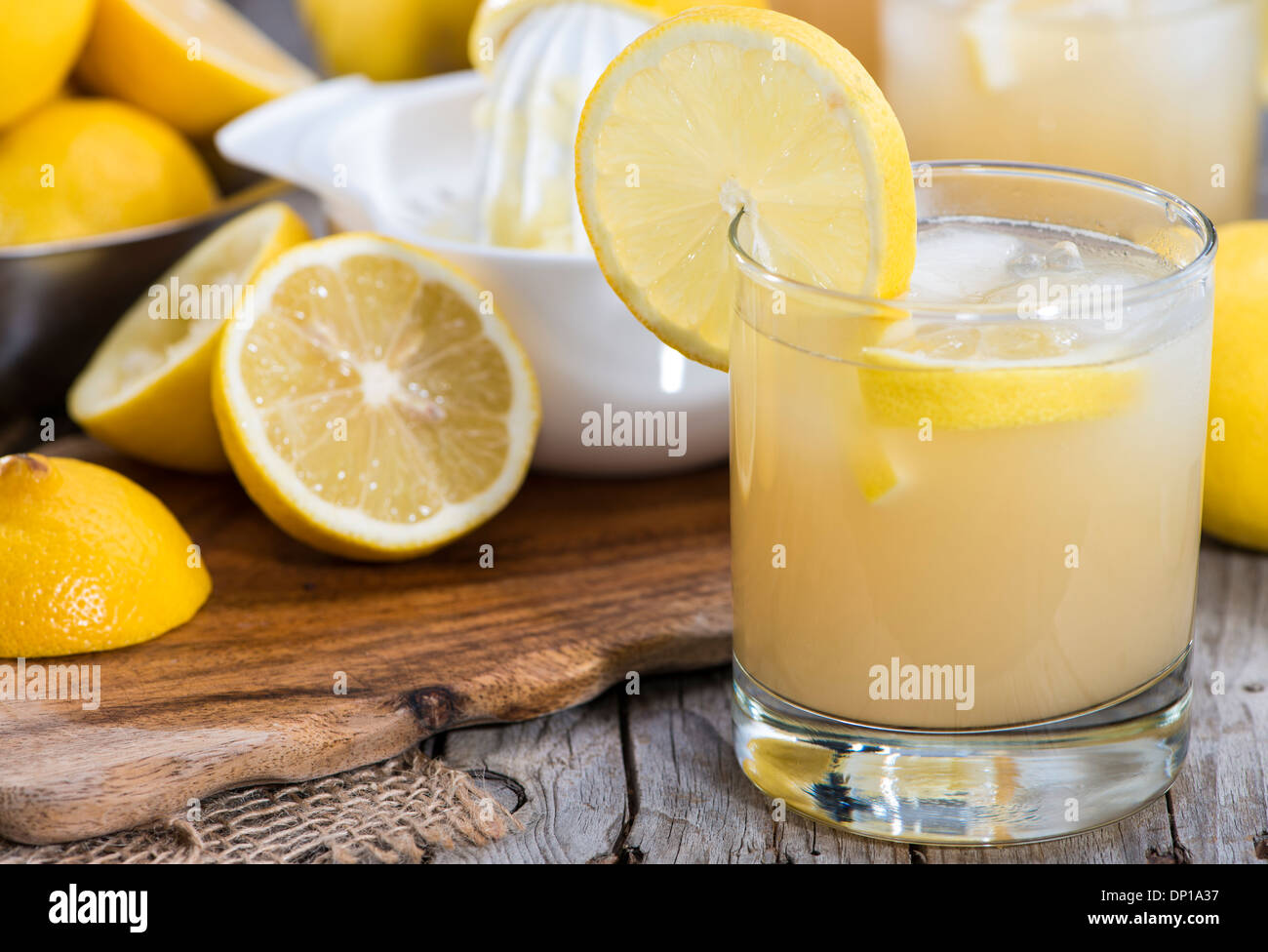 Glass filled with fresh made Lemon Juice Stock Photo - Alamy