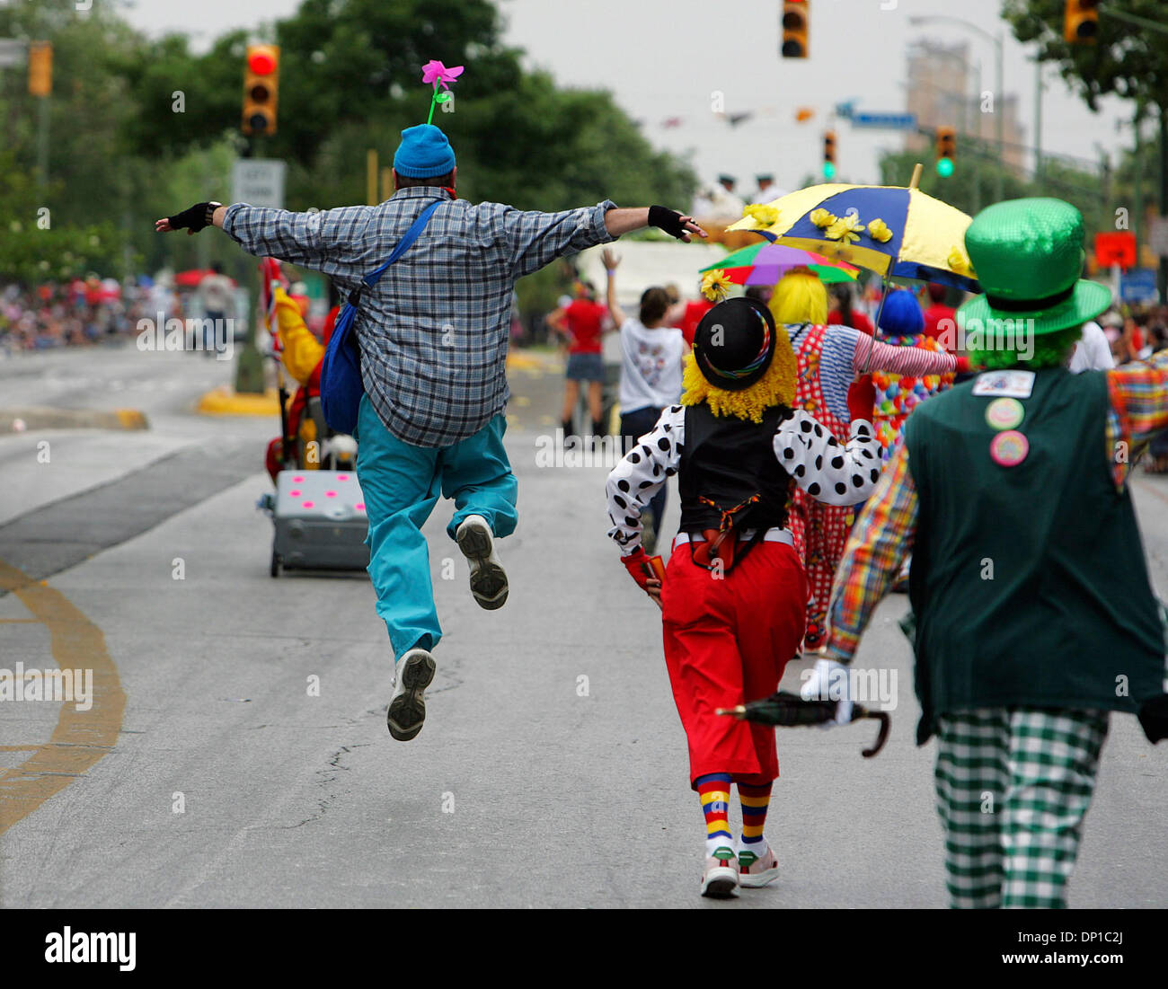 Apr 28, 2006; San Antonio, TX, USA; A clown runs and jumps along the ...