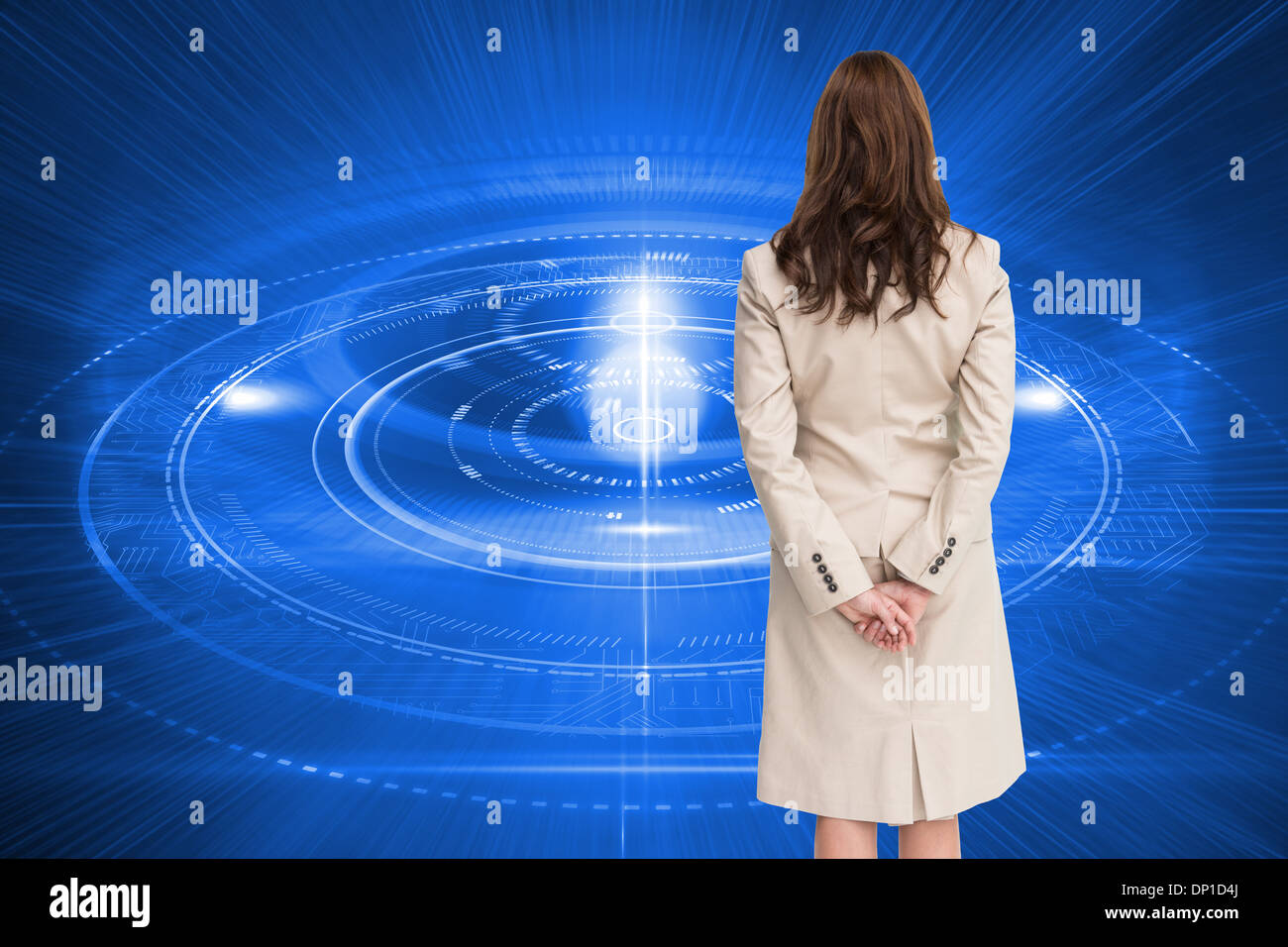 Composite image of rear view of businesswoman Stock Photo - Alamy