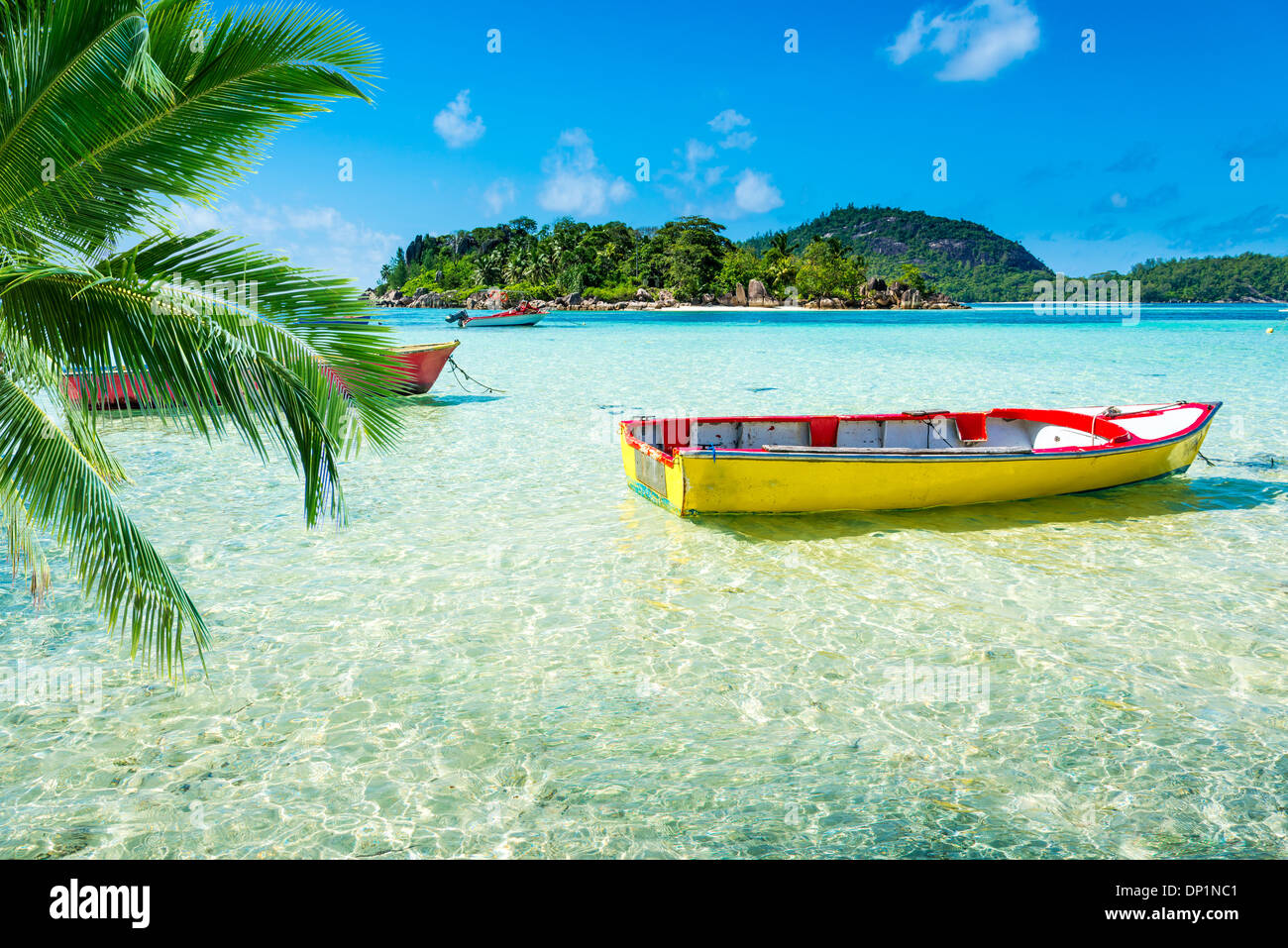 tropical beach with a boat Stock Photo - Alamy
