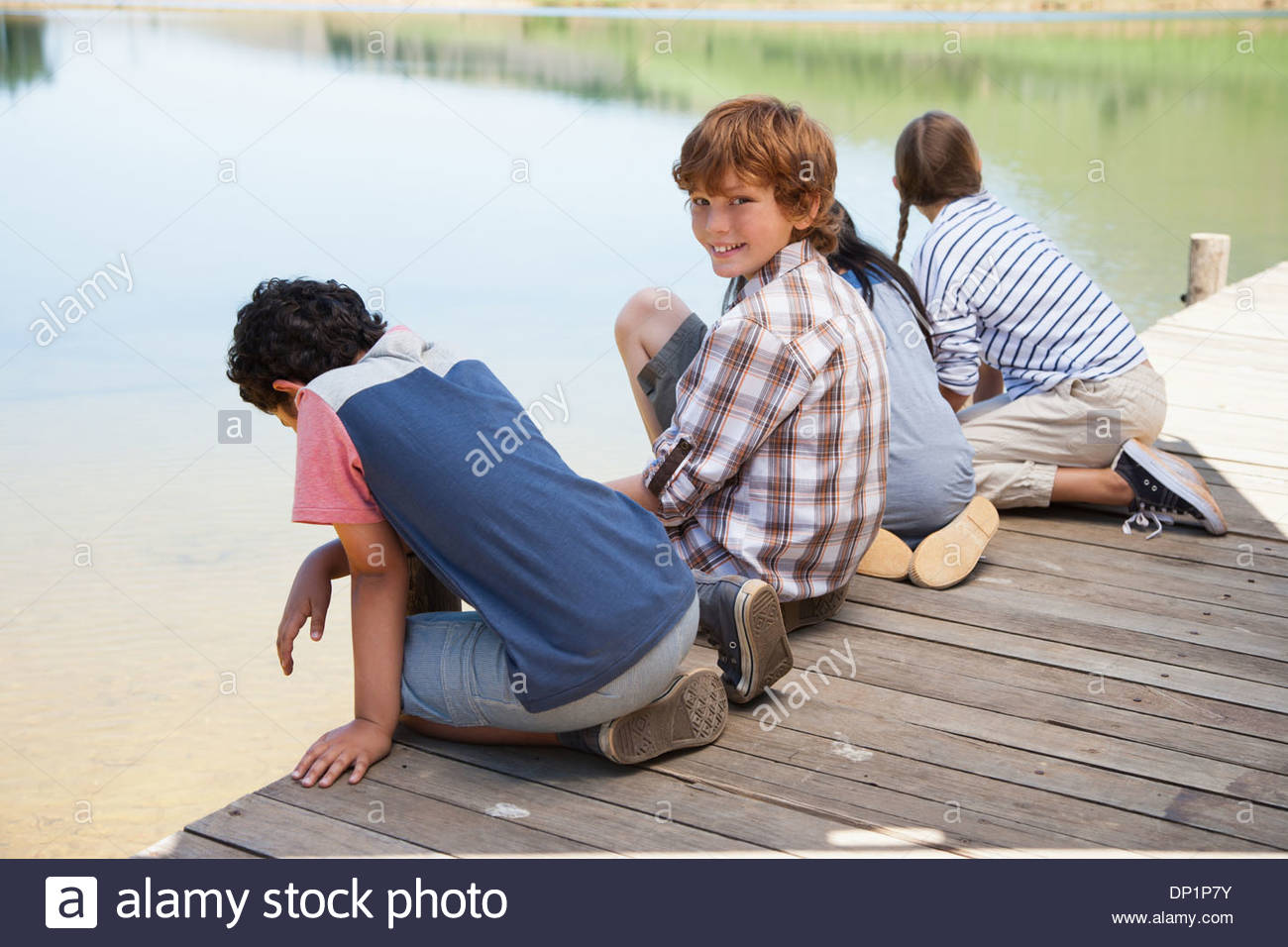 Kids Sitting On Dock Stock Photos & Kids Sitting On Dock Stock Images ...