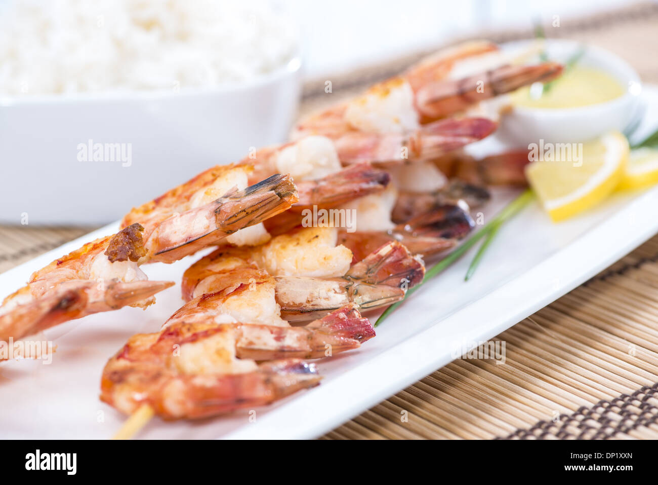 Fresh fried Tiger Prawns on a spit Stock Photo - Alamy
