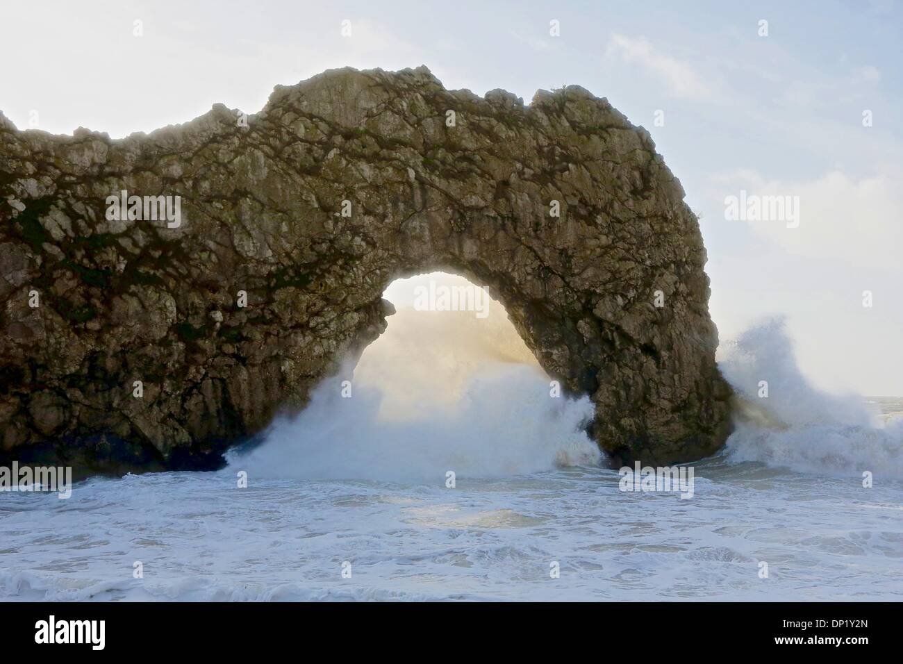 Durdle Door, Dorset, UK. 7th January 2014: Waves crash through Durdle ...