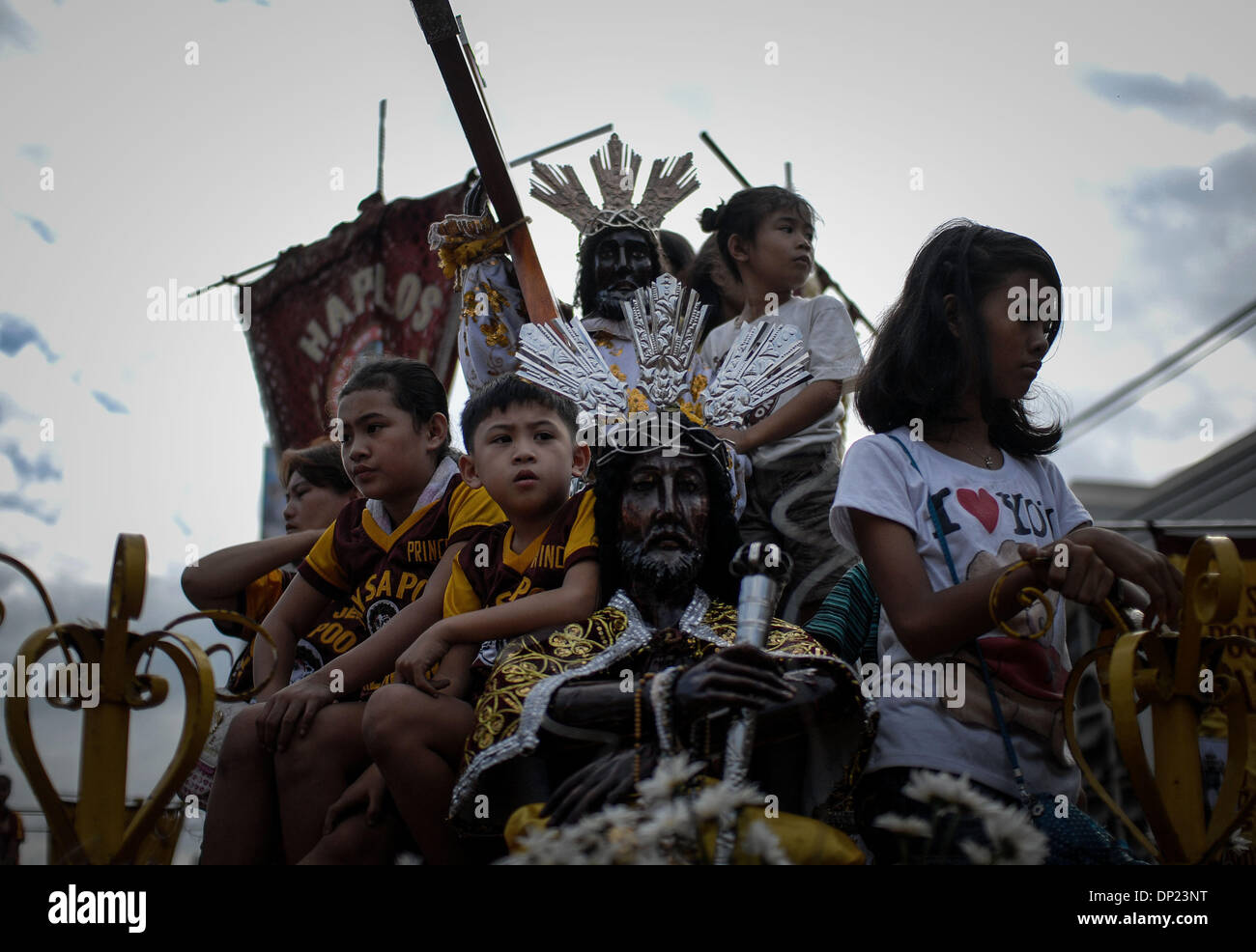 Manila, Philippines. 7th Jan, 2014. Devotees take part in the parade of ...