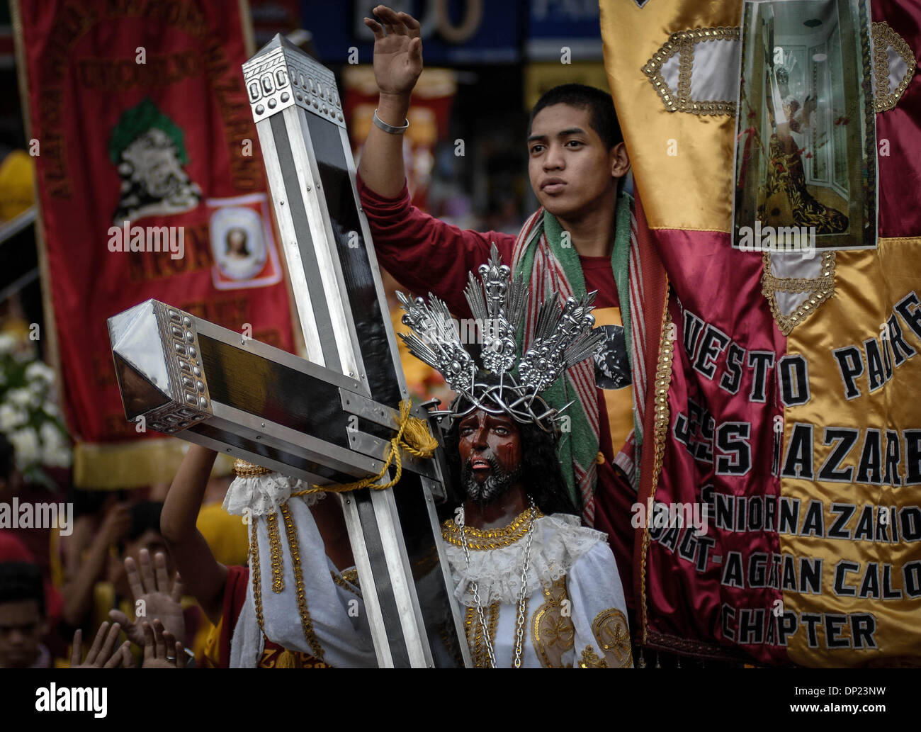 Manila, Philippines. 7th Jan, 2014. Devotees take part in the parade of ...
