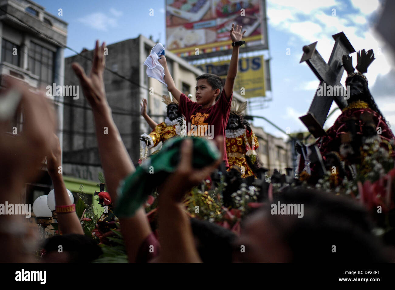 Manila, Philippines. 7th Jan, 2014. Devotees take part in the parade of ...