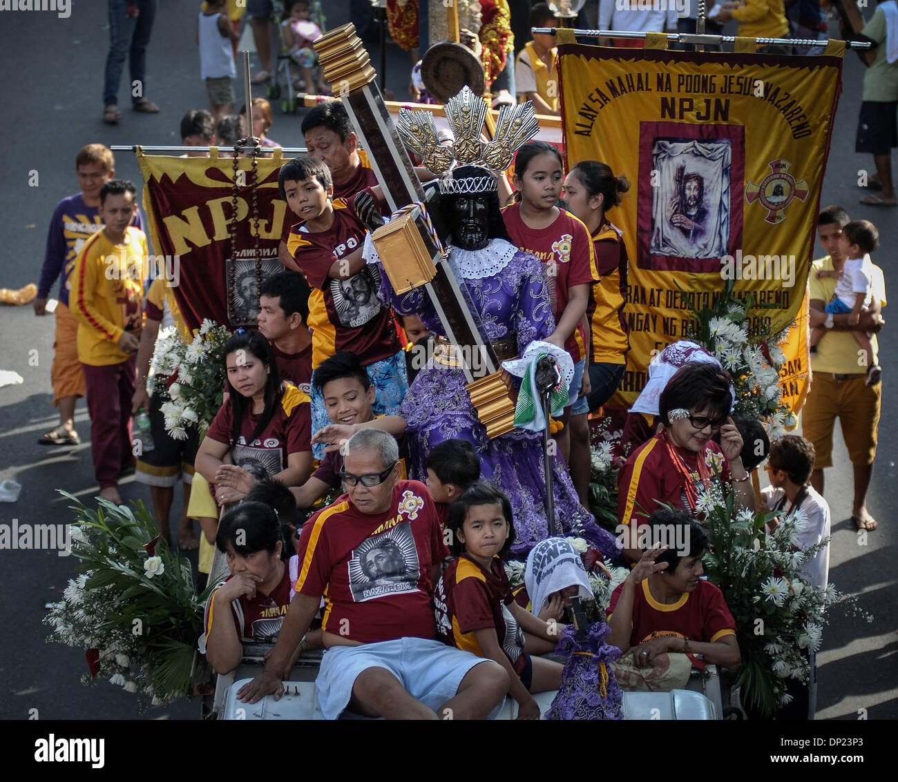 Manila, Philippines. 7th Jan, 2014. Devotees take part in the parade of ...