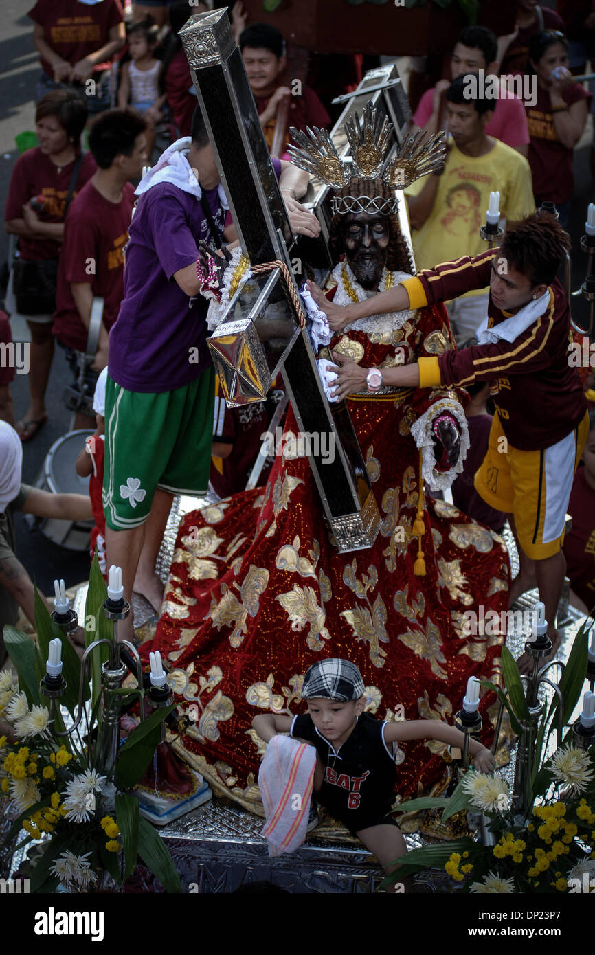 Manila, Philippines. 7th Jan, 2014. Devotees take part in the parade of ...