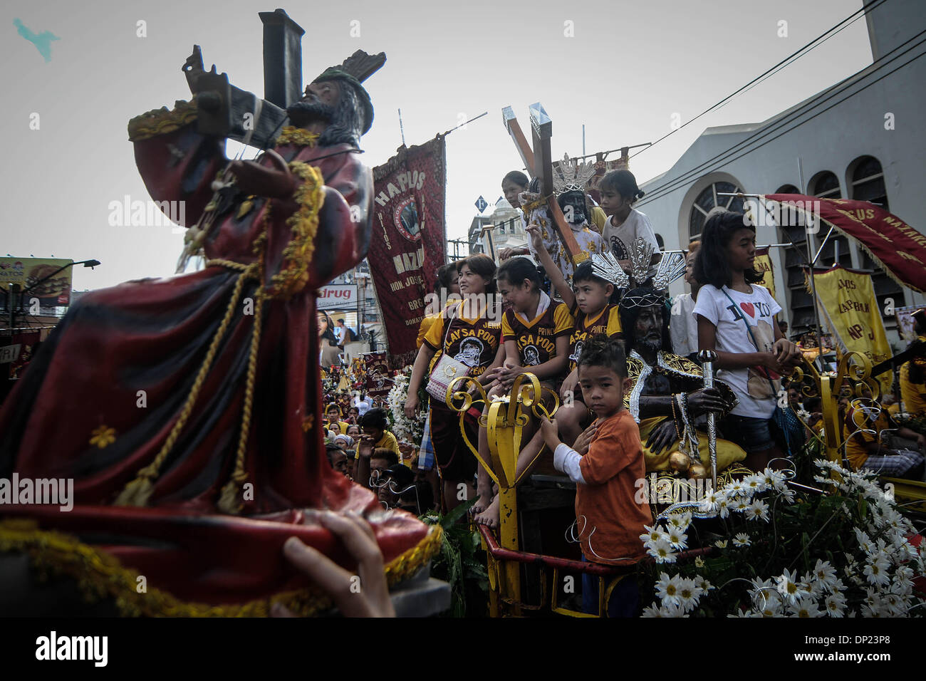 Manila, Philippines. 7th Jan, 2014. Devotees take part in the parade of ...