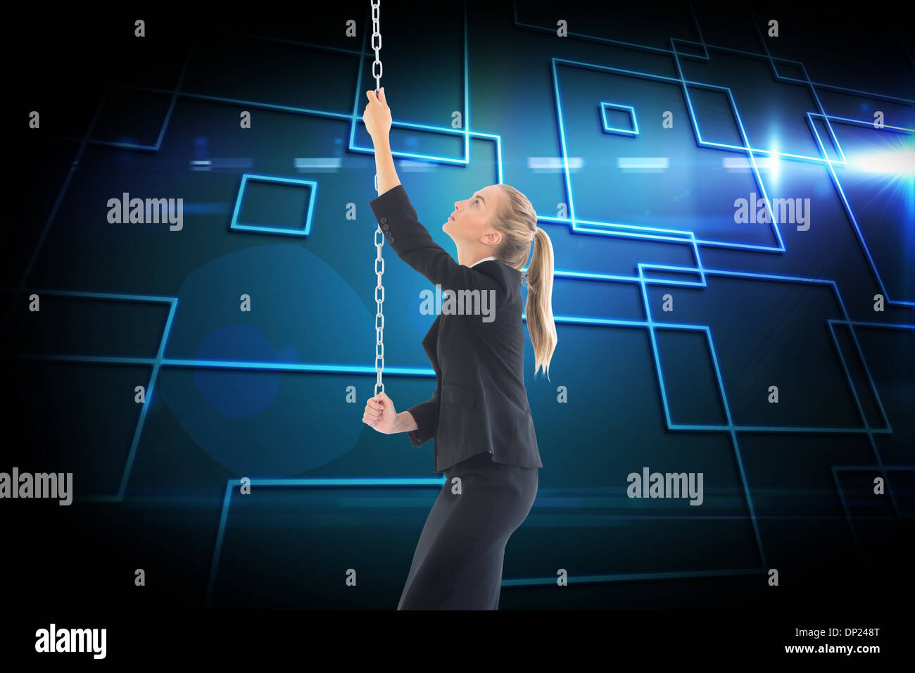 Composite image of businesswoman pulling a chain Stock Photo - Alamy