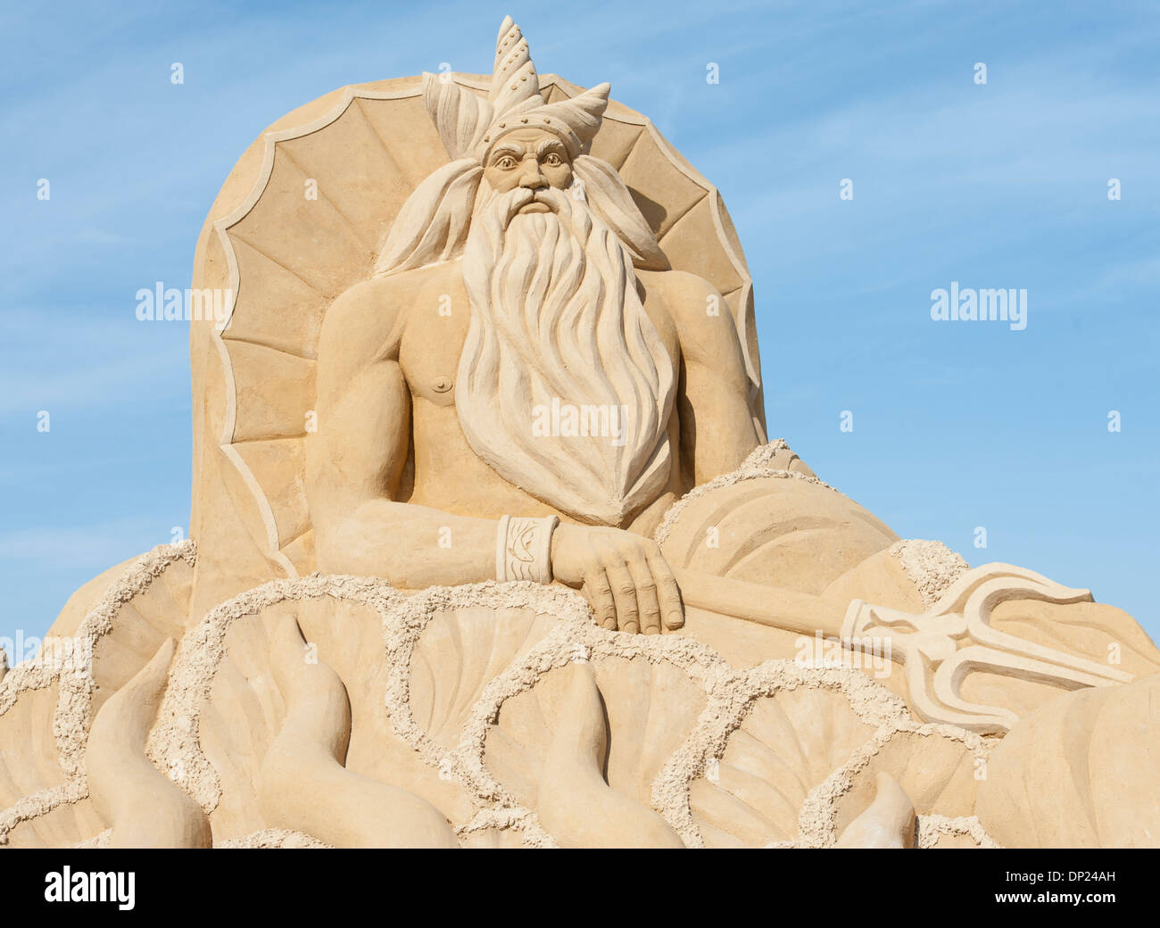 Large sand sculpture of the greek god of sea poseidon at sand city ...