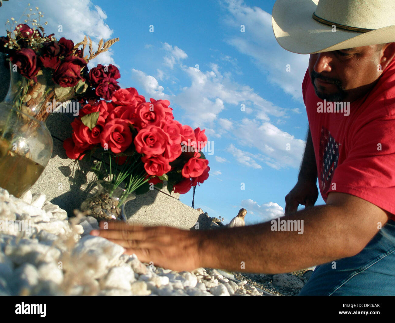 May 18, 2006; Redford, TX, USA; Margarito Hernandez tends the flowers ...