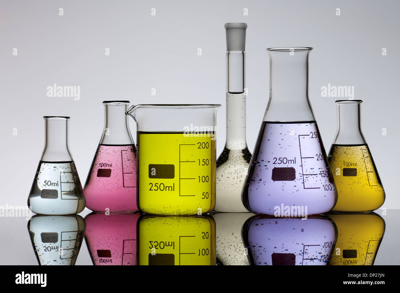 group of laboratory flasks containing liquid color Stock Photo - Alamy