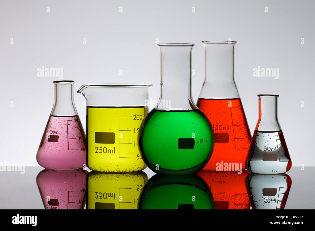 forefront of a laboratory flasks filled with colored liquid Stock Photo ...