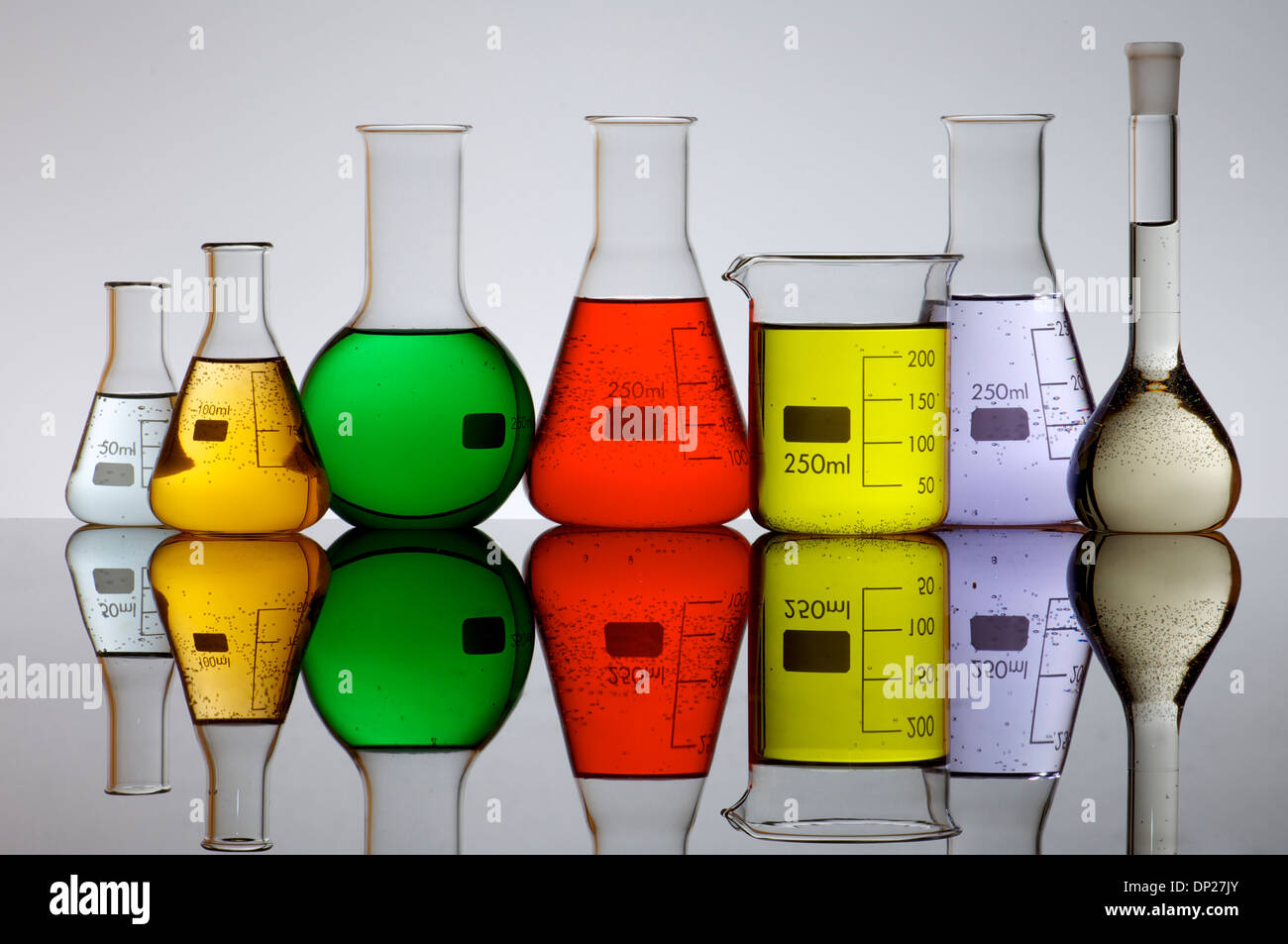 forefront of a laboratory flasks filled with colored liquid Stock Photo ...