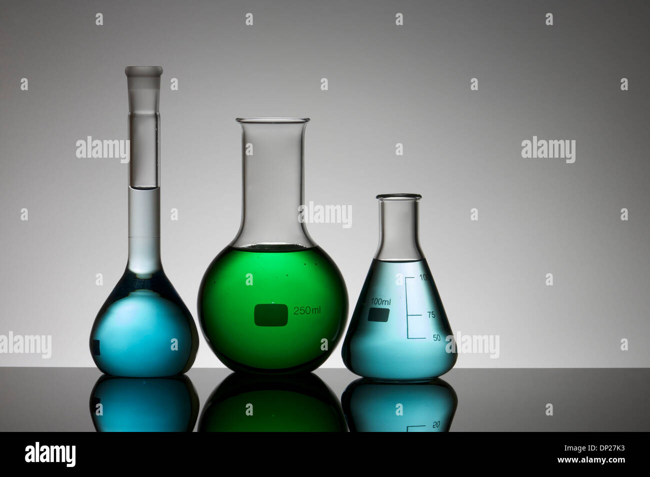 group of laboratory flasks containing liquid color Stock Photo - Alamy