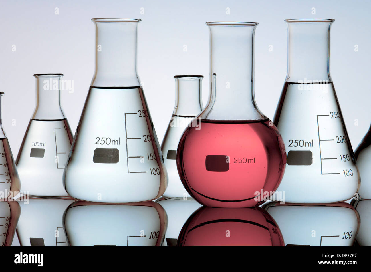group of laboratory flasks containing liquid color Stock Photo - Alamy