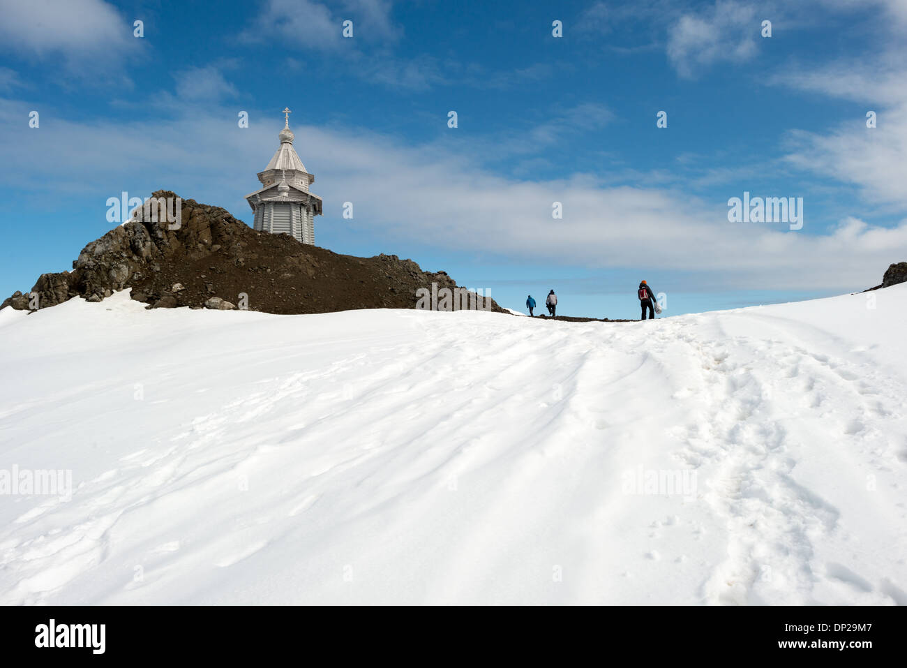 KING GEORGE ISLAND, Antarctica — Visitors walk up a steep, snowy hill to reach Trinity Church, a ...