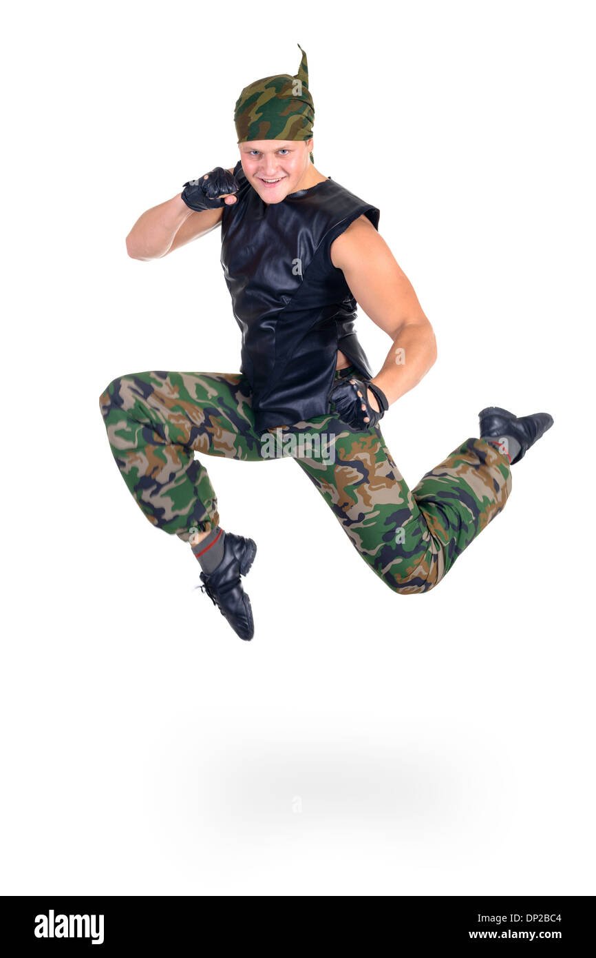 dancer dressed soldier showing some movements against isolated white ...