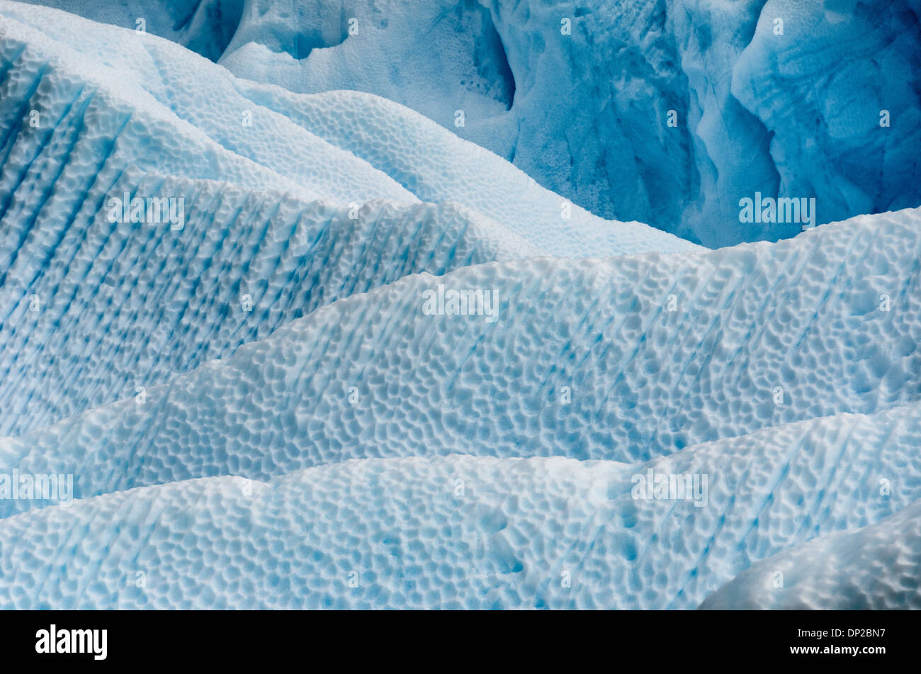 ANTARCTICA - Intricate shapes carved into an Antarctic iceberg floating ...