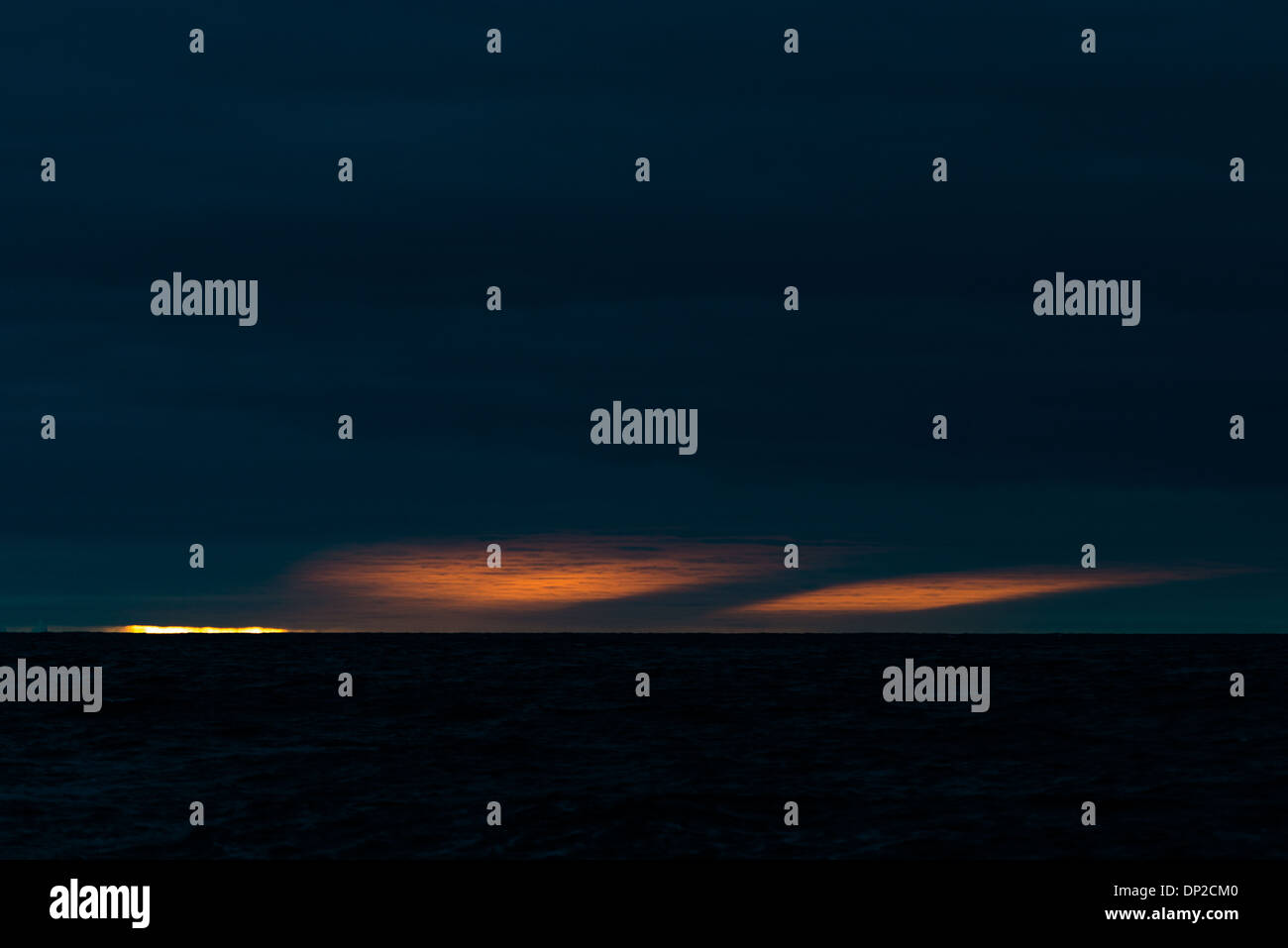Glow from sun setting below horizon hi-res stock photography and images ...
