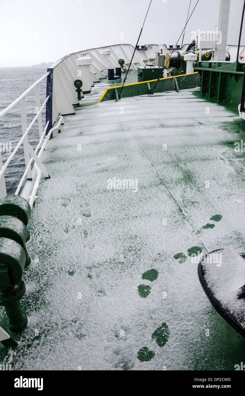 ANTARCTICA - The bow deck of a ship in Antarctica in covered in a thin ...