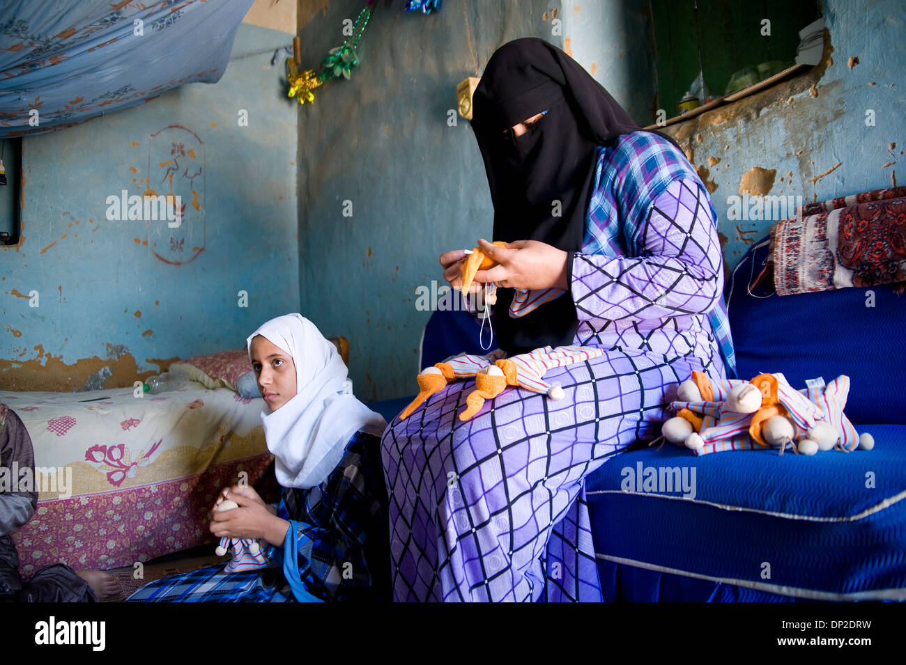 Bilbeis, Egypt: Young Egyptian women working as a seamstress at home ...