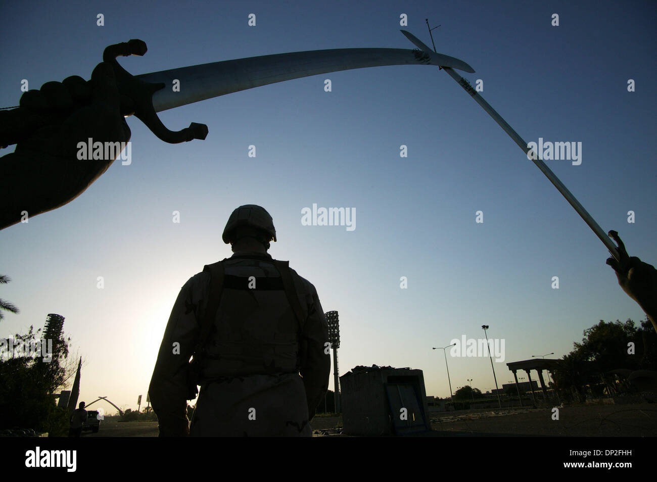 Jun 01, 2006; Baghdad, IRAQ; An American soldier stands in silhouette ...
