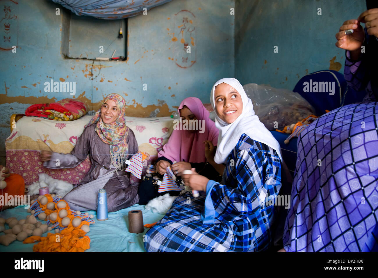 Bilbeis, Egypt: Young Egyptian women working as a seamstress at home ...