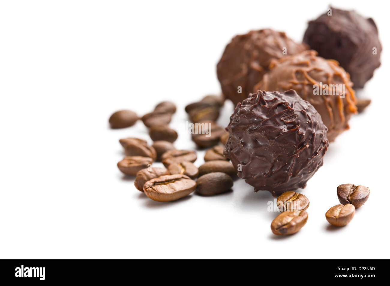 chocolate truffles with cocoa beans on white background Stock Photo - Alamy