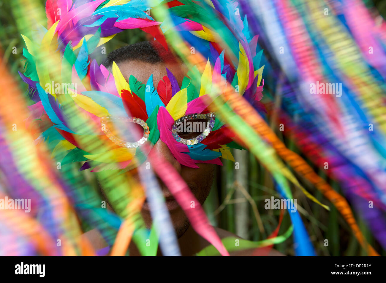 Rio Carnival scene features Brazilian man in colorful mask looking ...