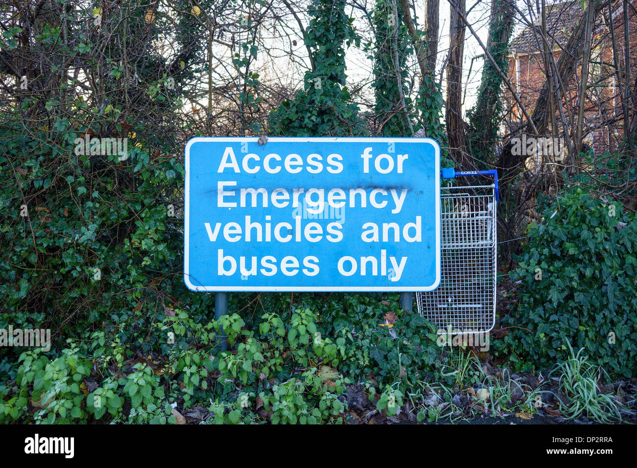 Access for emergency vehicles and buses only sign with abandoned Tesco ...
