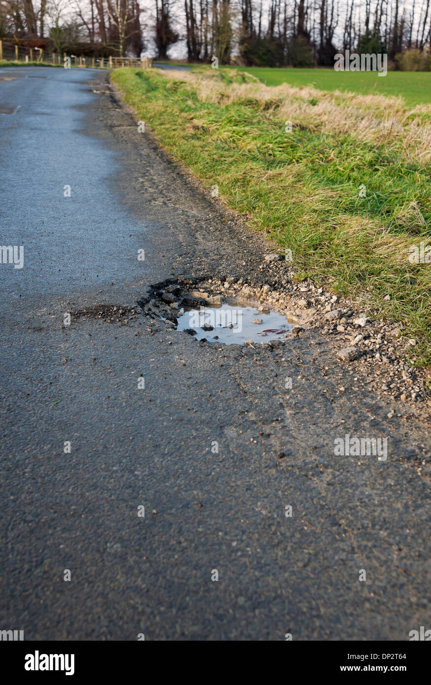 Pothole and puddle in road hi-res stock photography and images - Alamy