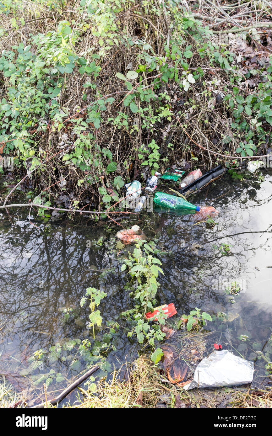 Litter dumped in a stream Stock Photo - Alamy