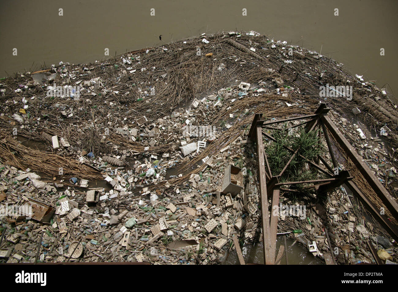 Jun 11, 2006; Baghdad, IRAQ; Garbage and debris collect under a bridge ...