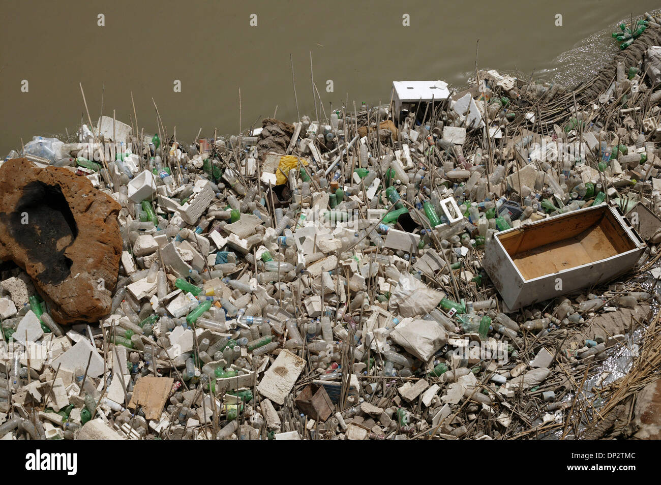 Jun 11, 2006; Baghdad, IRAQ; Garbage and debris collect under a bridge ...