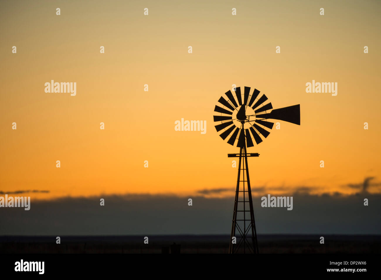 Colorado windmill at sunset Stock Photo - Alamy