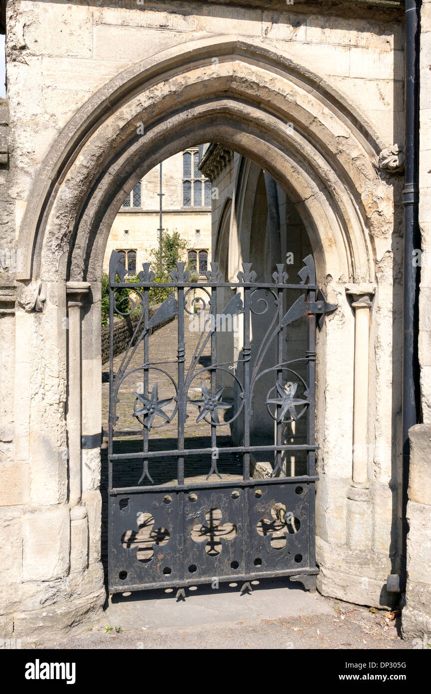 Wrought iron gate and stone arch at entrance to a church in Trowbridge ...