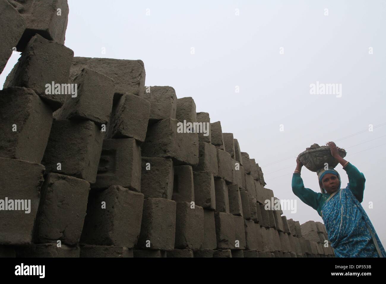 Bangladeshi woman daily laborer working winter morning in a brickfield ...