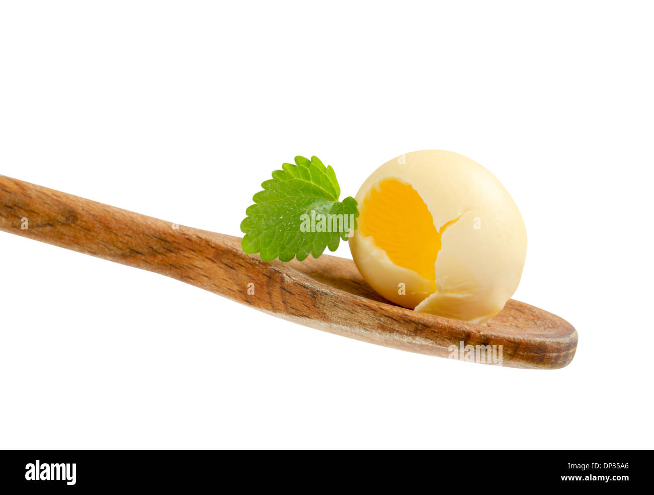 Curl of fresh butter on a wooden spoon Stock Photo - Alamy